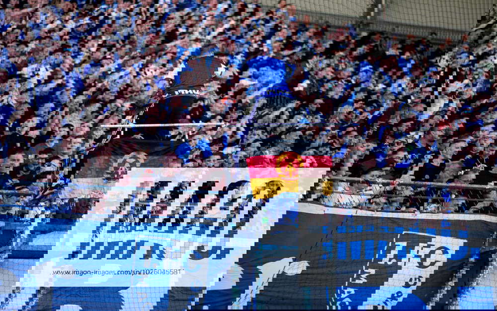 Fans and Ultras of the FCM in the guest block with old DDR flag, GER ...