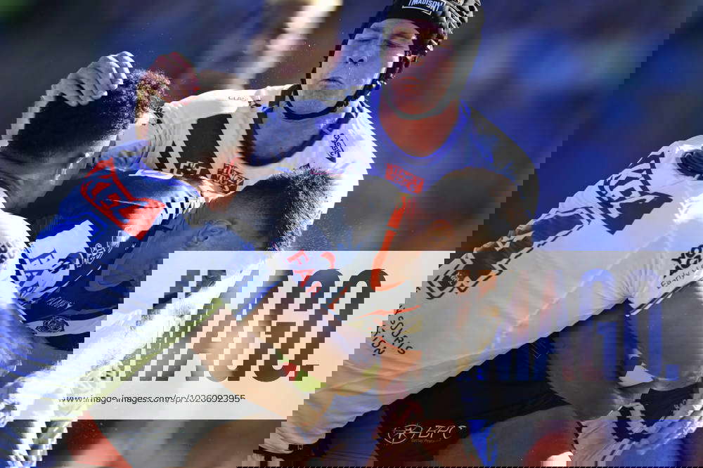 NRL BULLDOGS TIGERS, David Nofoaluma of the Tigers is tackled by Matt ...