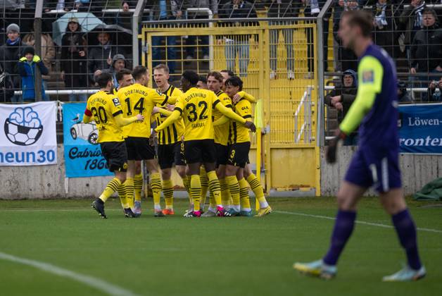 Dortmund players celebrate with Ole Pohlmann BV Borussia Dortmund U23 ...