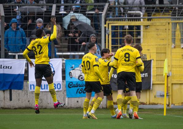 Dortmund players celebrate with Ole Pohlmann BV Borussia Dortmund U23 ...