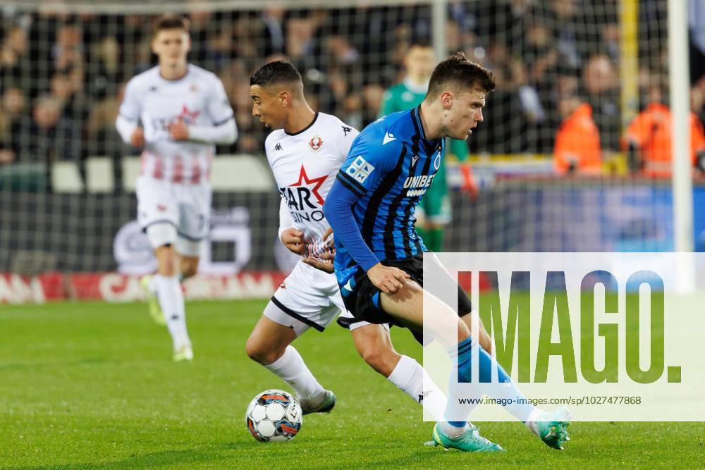 Club s Andreas Skov Olsen and Seraing s Sami Lahssaini fight for the ...