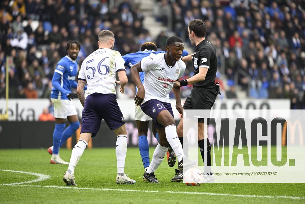 GENK, BELGIUM - APRIL 16 : Kana Marco defender of Anderlecht, referee ...