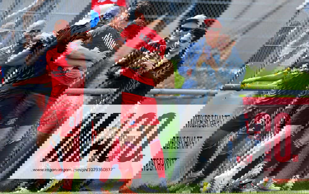 Unterhaching players celebrating a goal in front of the Unterhaching ...