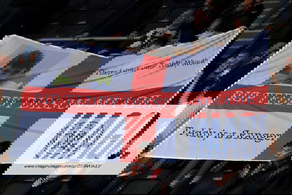 Queens Park Rangers fans hold up a banner in tribute to Teddy Disson ...