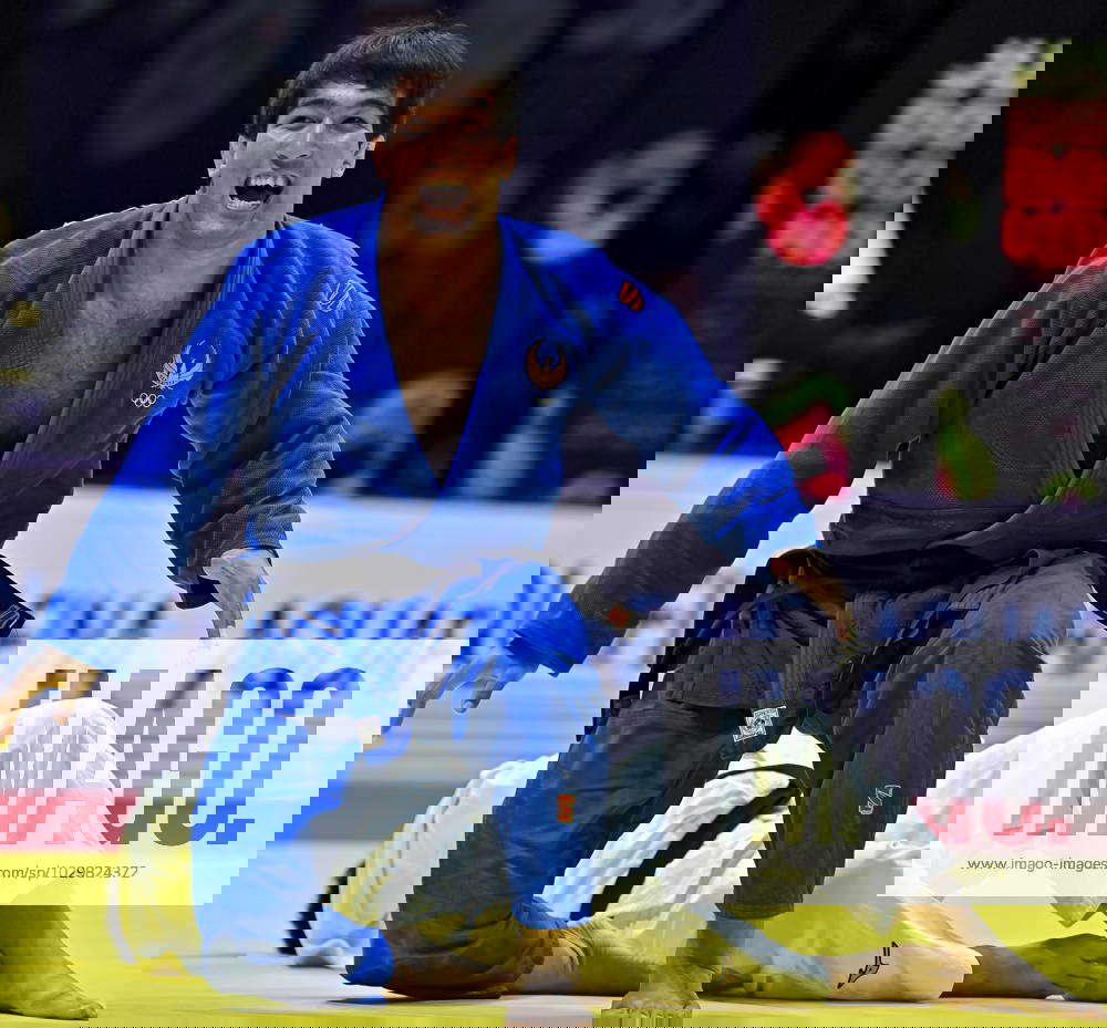 World Judo Championships Doha 2023 Alisher Yusupov (blue) of Uzbekistan reacts after winning