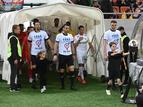 The refereeing team formed by Daniel Mitruti, Andrei Antonie and ...