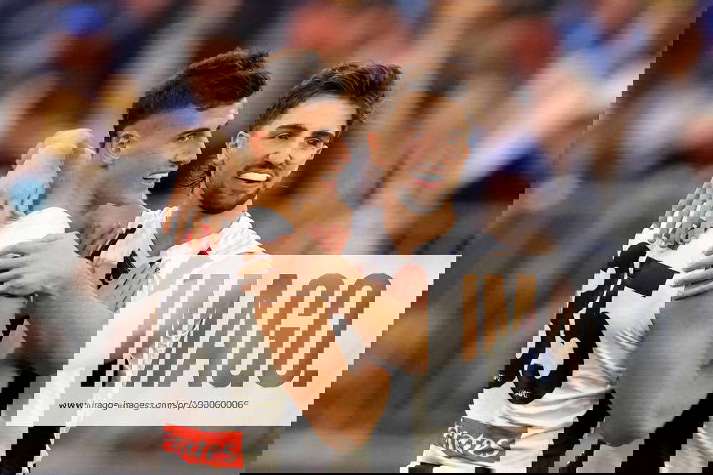 AFL EAGLES MAGPIES, Nick Daicos (l) of the Magpies is congratulated by ...