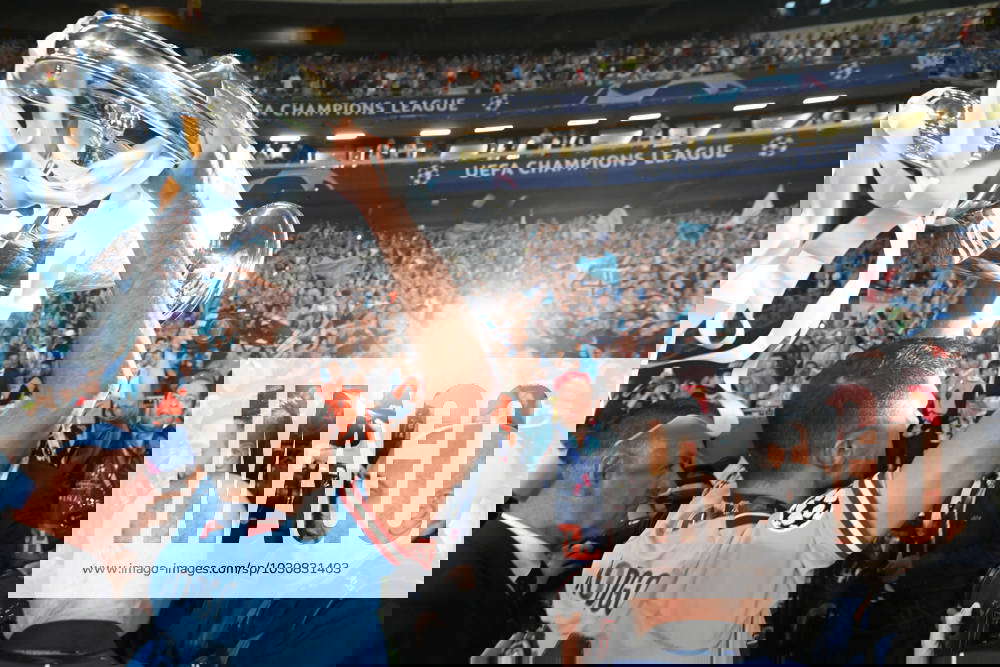 Rodri rejoices with the trophy and supporters after winning the ...