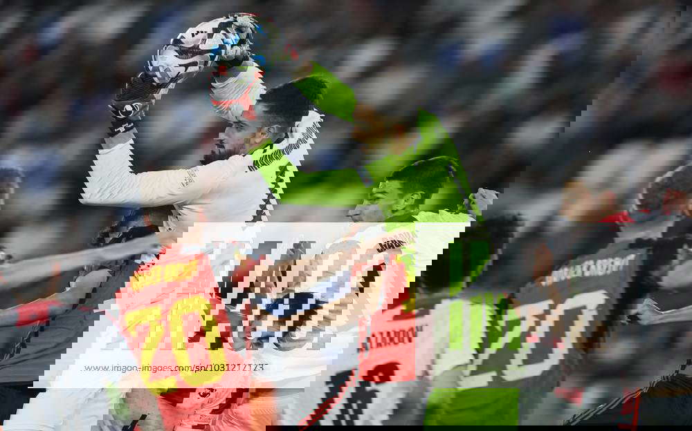 Georgia s goalkeeper Giorgi Mamardashvili fights for the ball during ...