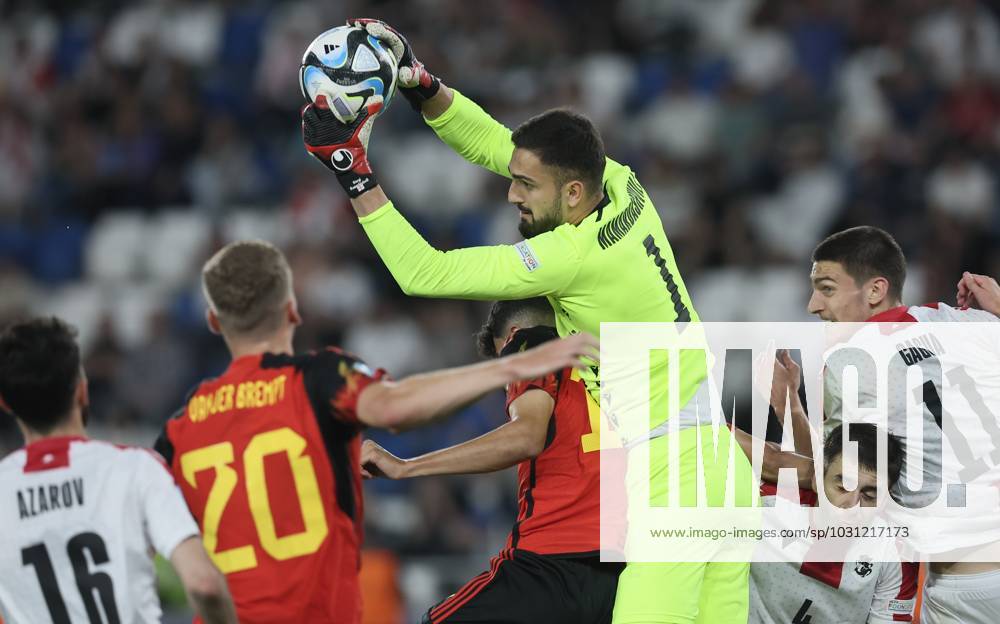 Georgia s goalkeeper Giorgi Mamardashvili fights for the ball during ...