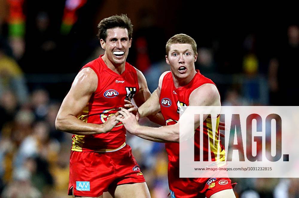 AFL SUNS HAWKS, David Swallow of the Suns celebrates a goal with Matt ...
