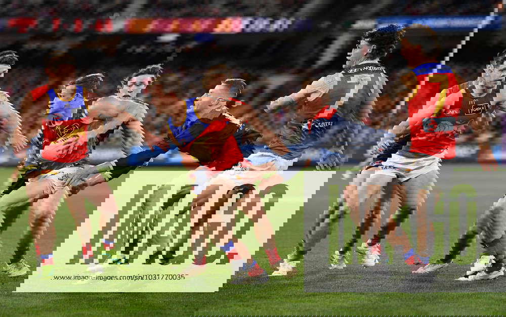 AFL DEMONS LIONS, Ryan Lester of the Lions takes possession of the ball ...