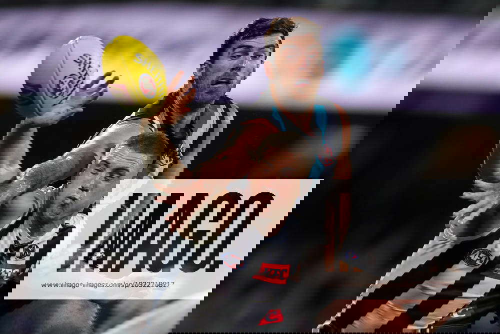 AFL POWER MAGPIES, Scott Lycett of the Power and Darcy Cameron of the ...