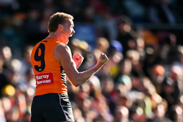 AFL GIANTS SUNS, Ryan Angwin of the Giants (centre) celebrates with ...