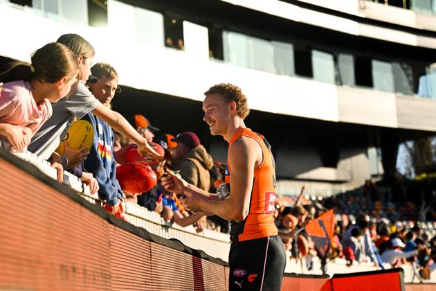 AFL GIANTS SUNS, Ryan Angwin of the Giants (centre) celebrates with ...