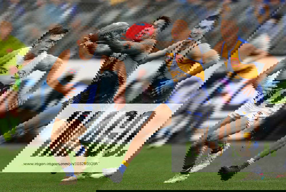 AFL EAGLES KANGAROOS, Tim Kelly of the Eagles gets away from Will ...