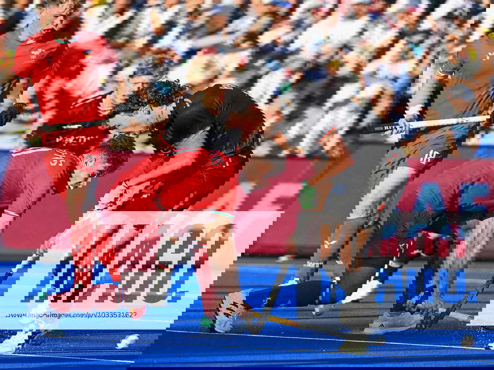 Gareth Griffiths Wales, 31 takes the ball from Teo Hinrichs Germany, 14 ...