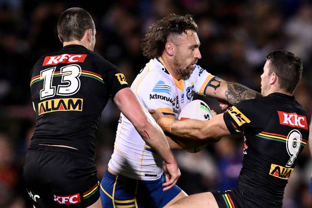 NRL PANTHERS EELS, Bryce Cartwright of the Eels is tackled by James ...