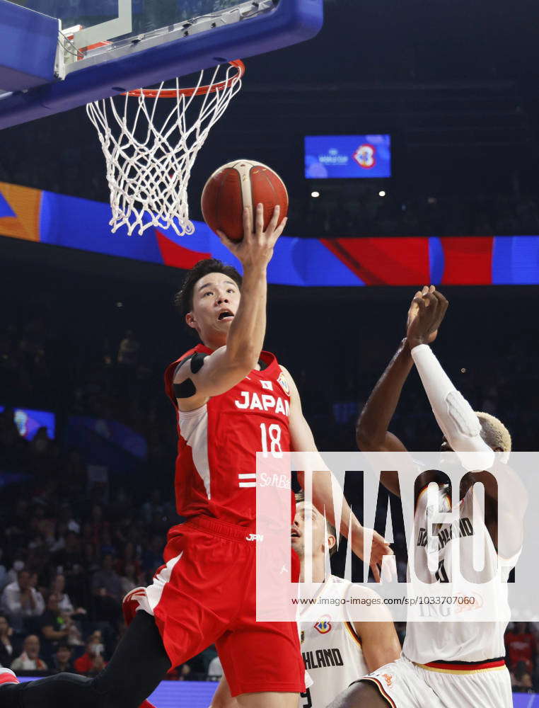 Basketball: World Cup Japan s Yudai Baba (L) shoots the ball during the ...