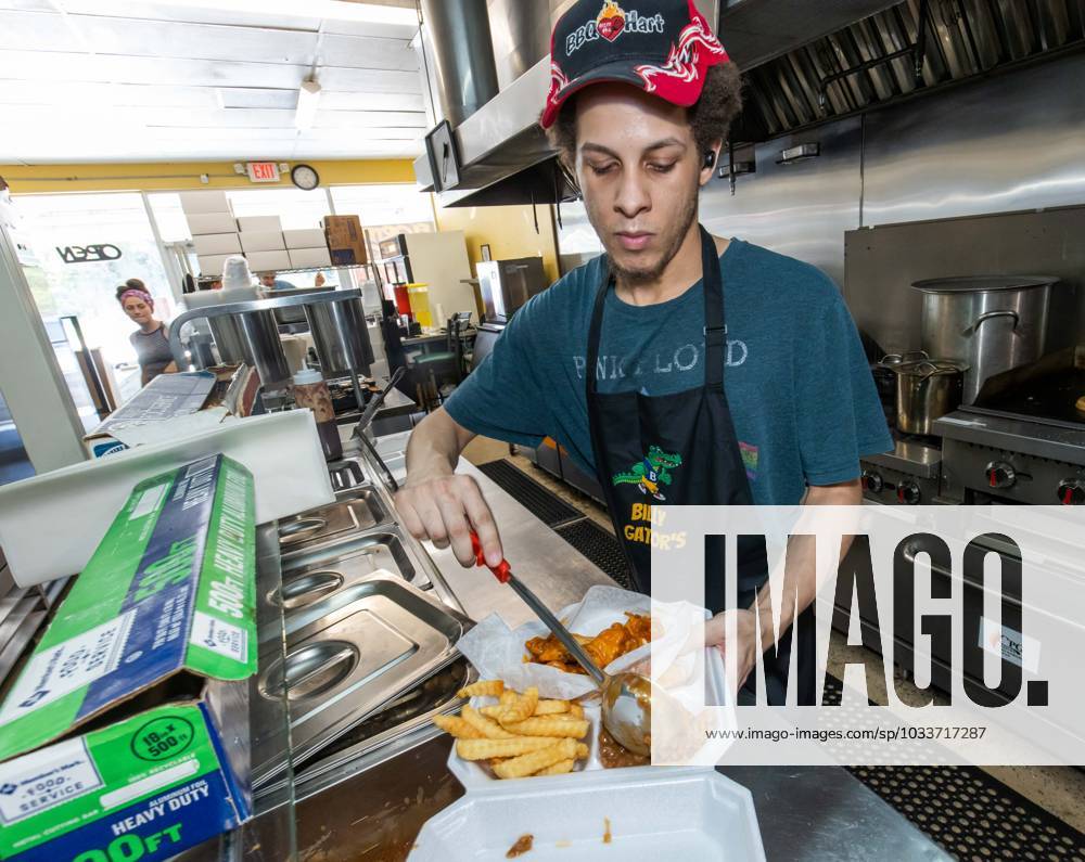 Syndication: Ocala StarBanner Dominick Gordon makes an order of wings ...