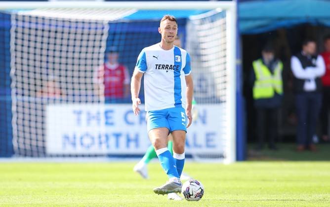 Barrow v Wrexham - Sky Bet League 2 Barrow s George Ray holds off ...