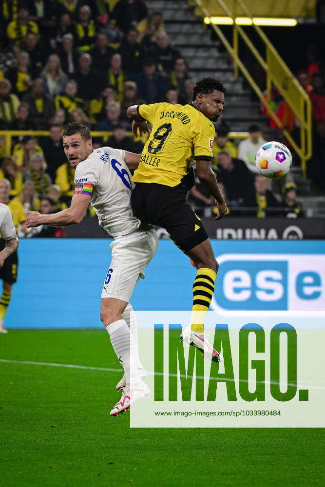 Patrick Mainka 6 Heidenheim one-on-one, action, with Sebastien Haller 9 ...