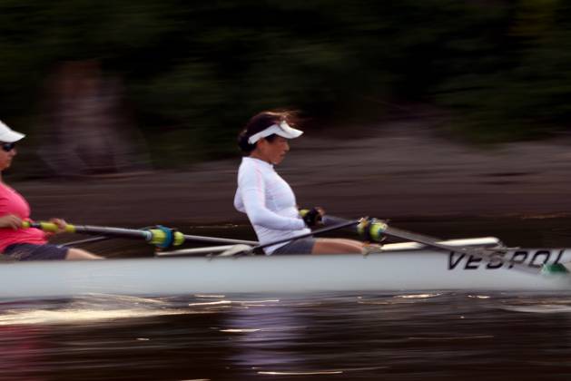 Members of the Minneapolis Rowing Club in a 4 person shell during an ...
