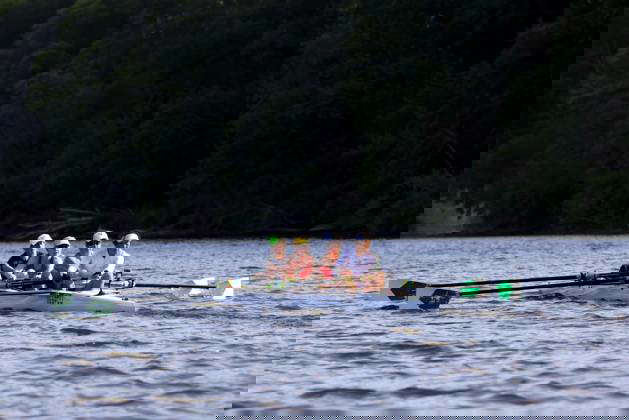 Members of the Minneapolis Rowing Club in a 4 person shell during an ...