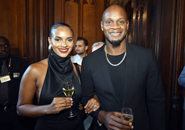 Former sprinter Asafa Powell ans his wife Alyshia Miller-Powell pose ...