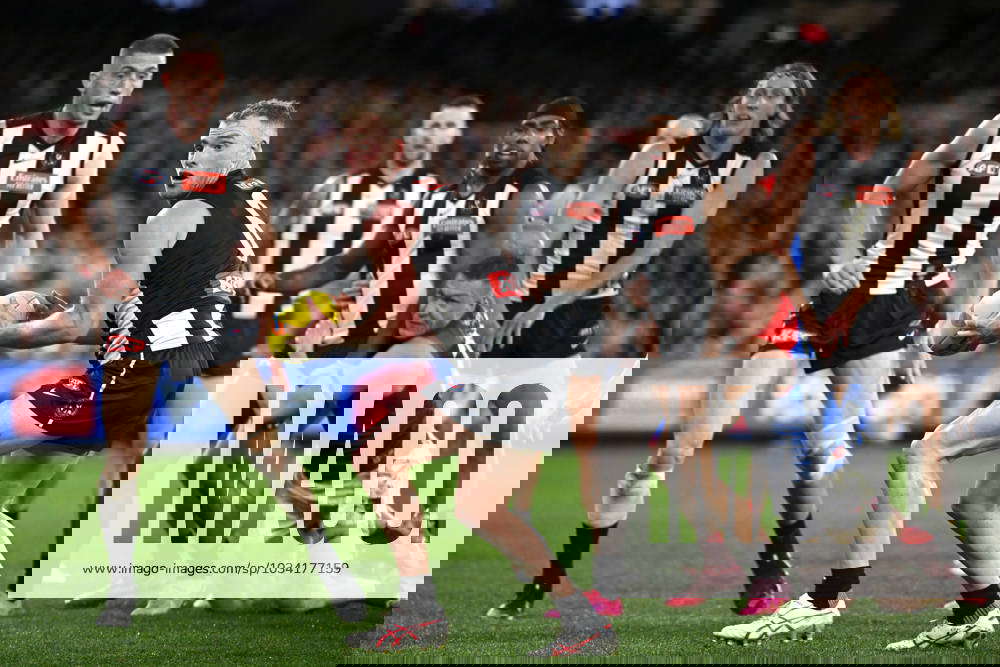 AFL MAGPIES DEMONS, Tom Mitchell of Collingwood gathers the ball during ...