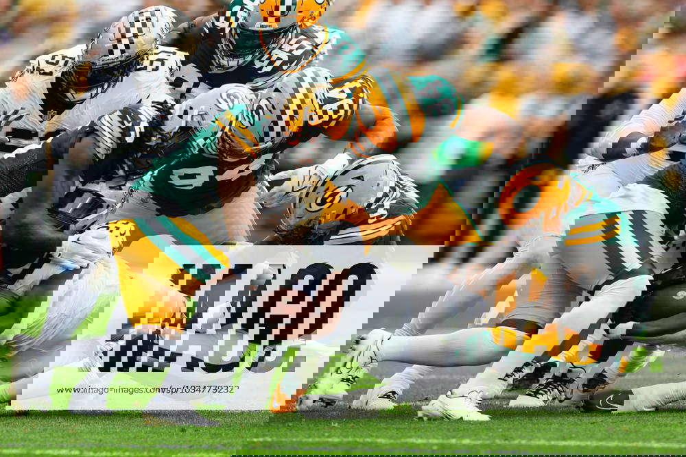 : Green Bay Packers linebacker Quay Walker and safety Rudy Ford tackle ...