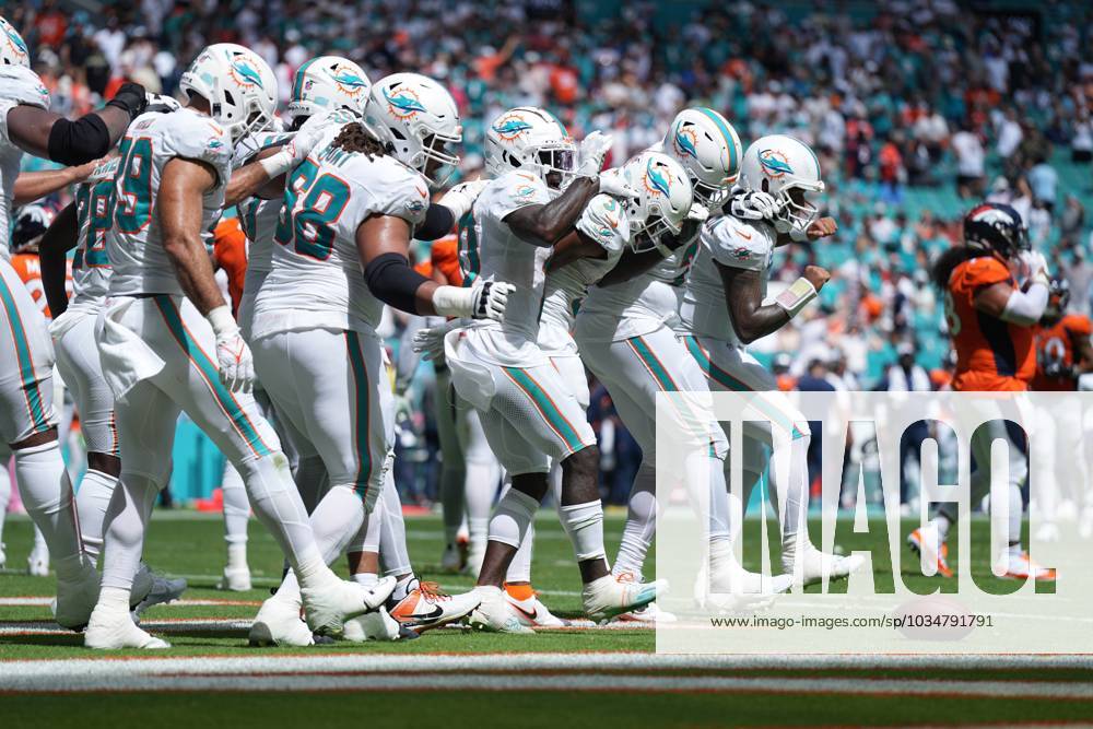 Syndication: Palm Beach Post The Miami Dolphins offense does a dance routine after scoring against