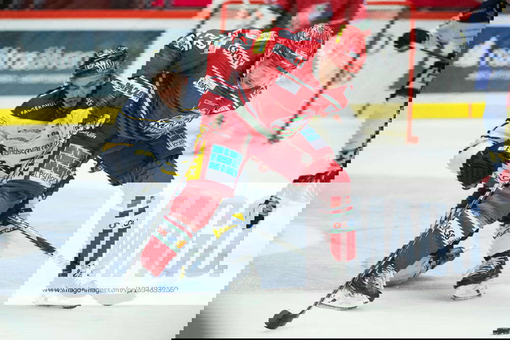 230926 MoDos Adam Pettersson and HV71s Isac Brännström during the SHL ice hockey match between