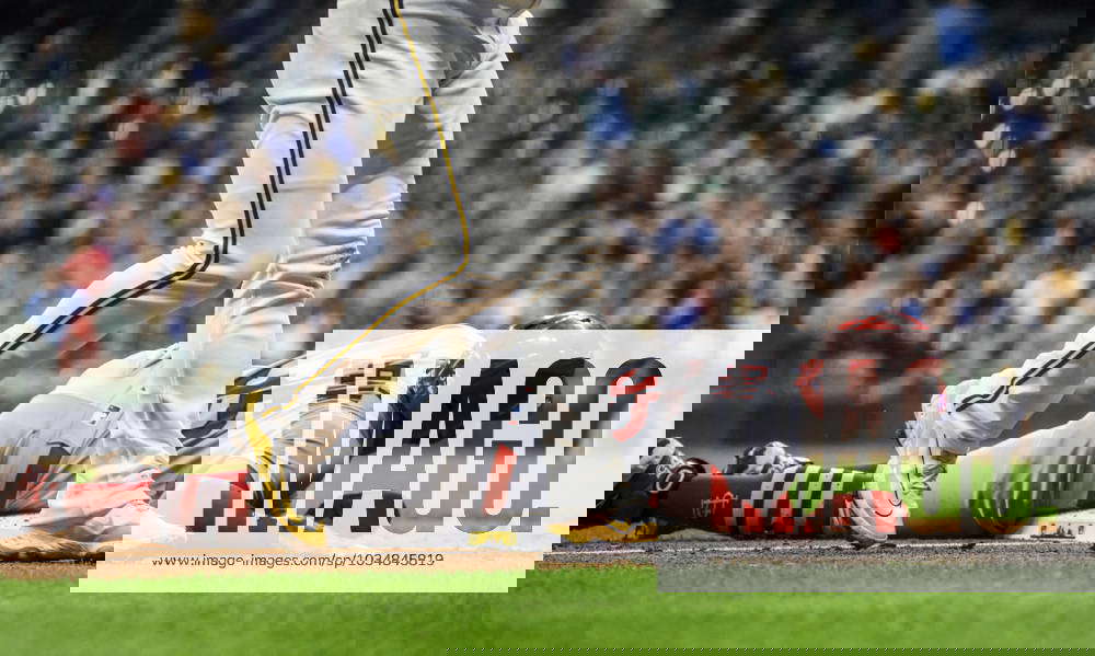 St. Louis Cardinals third baseman Jose Fermin is thrown out at third ...