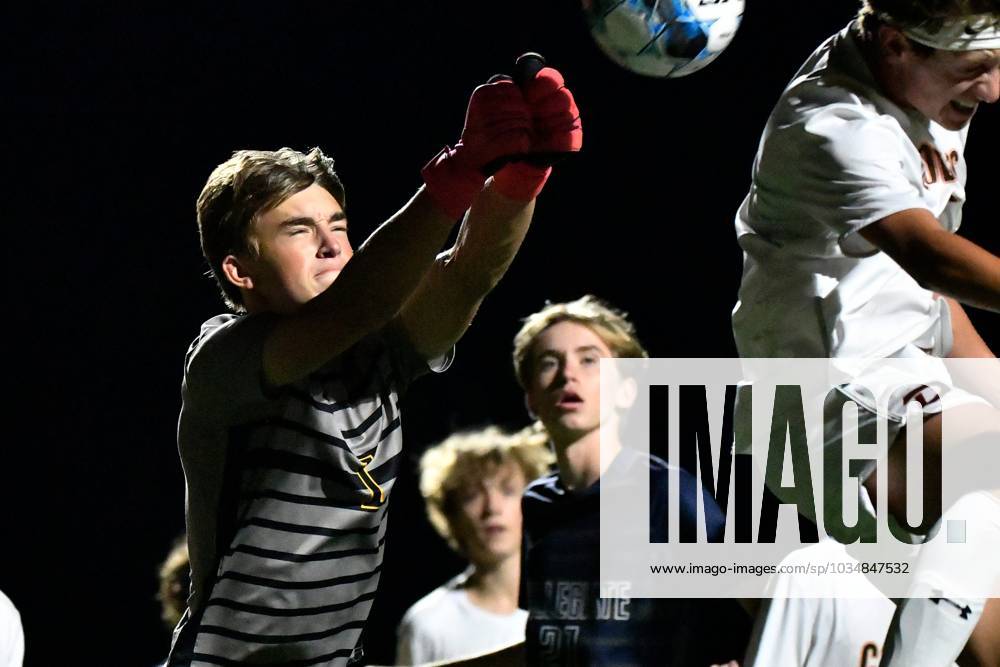 Syndication: The Courier-Journal Collegiate s Crew Hartlage (1) punches ...