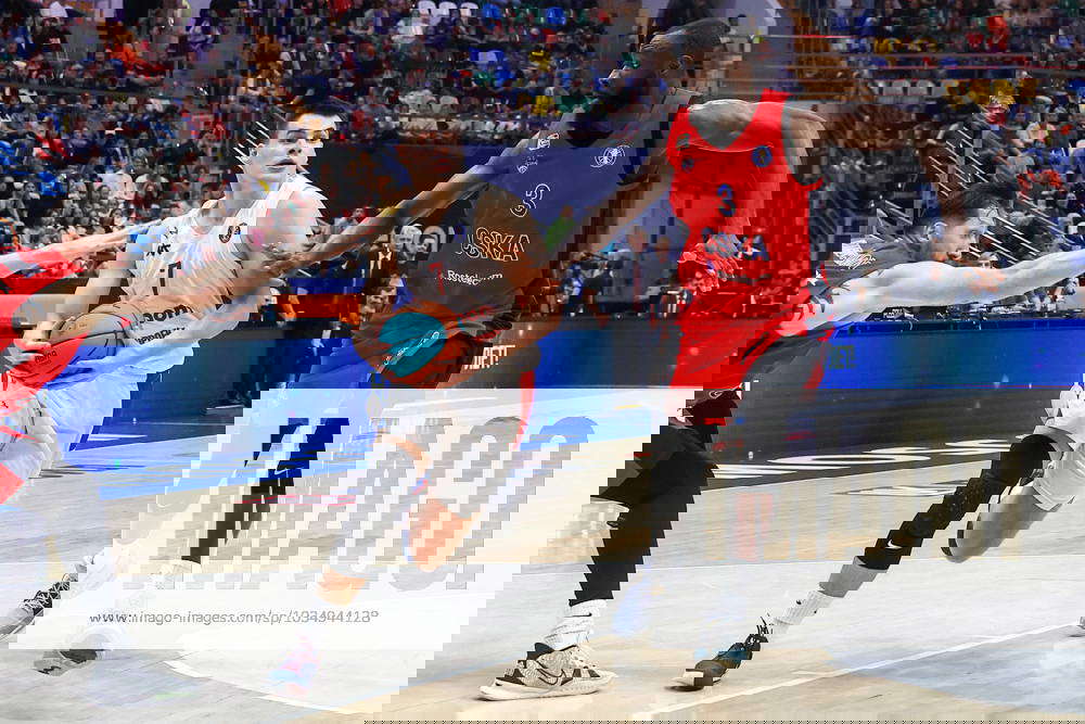 RUSSIA, MOSCOW - SEPTEMBER 30, 2023: BC MBA Moscow s Alexander Khomenko (C) dribbles past BC CSKA