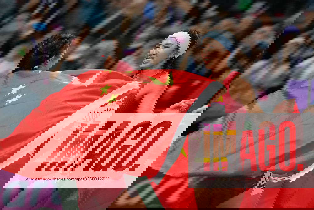 HANGZHOU, Oct. 1, 2023 -- Lin Yuwei and Wu Yanni of China celebrate after the Women s 100m Hurdles