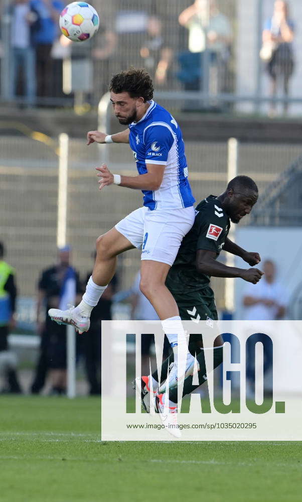 Emir Karic above against Naby Keita photographed at the soccer ...