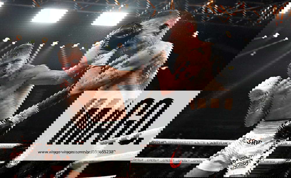 BOXING TSZYU MENDOZA, Wade Ryan of Australia (right) is struck during ...