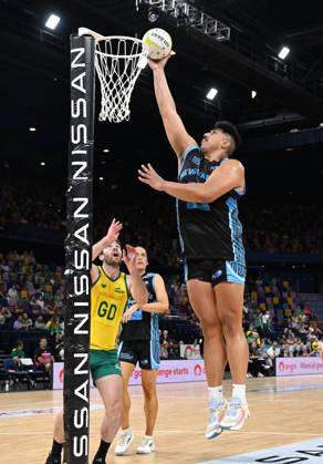 NETBALL AUSTRALIA NEW ZEALAND MEN Junior Levi of New Zealand left leaps over Dravyn Lee Tauroa