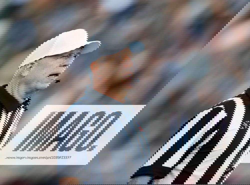 : Referee Wayne Winkler addresses the clock operator during an NCAA ...