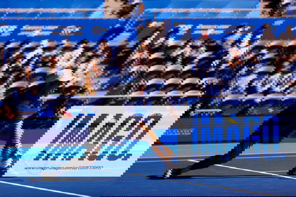 Tokyo, Japan: MACKENZIE MCDONALD hits a return against M. Purcell ...