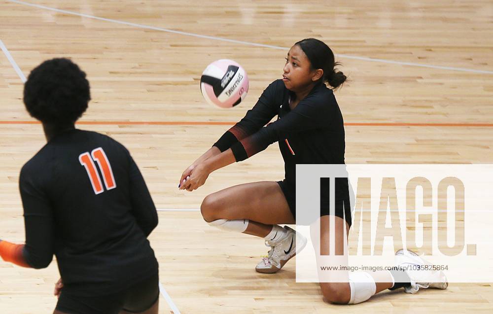 Syndication: The Ames Tribune Ames Paulena Kamau (1) returns the ball ...