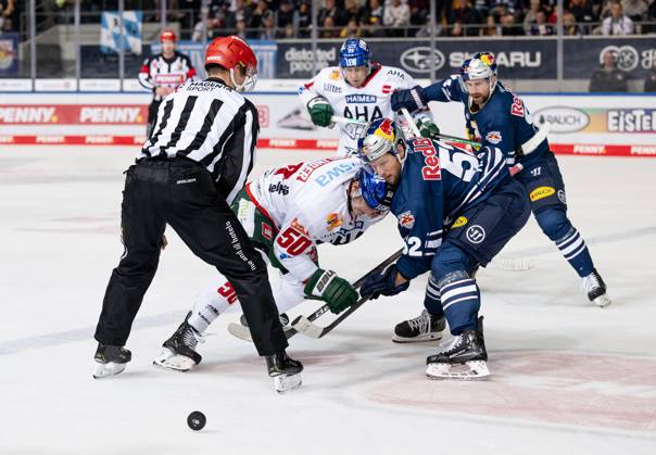 Linesman Tim Heffner takes a faceoff that Patrick Hager EHC Red Bull ...