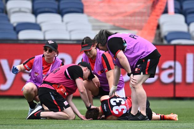AFLW CATS BOMBERS, Amber Clarke of Essendon leaves the field with an ...