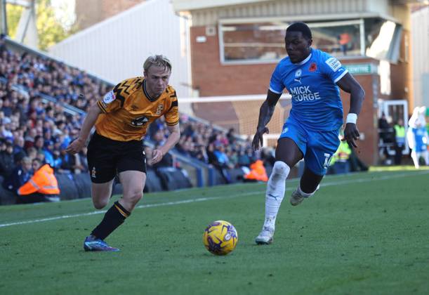 Liam Bennett (CU) Ephron Mason-Clark (PU) at the Peterborough United v ...