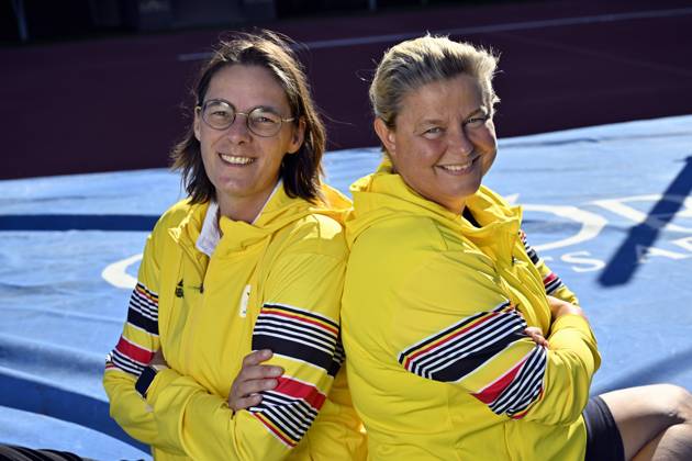 Coach Tia Hellebaut and coach Brigitte Becue pose for the photographer ...
