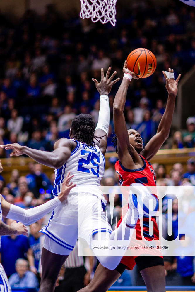 : Duke Blue Devils Mark Mitchell guards the shot from Souther Indiana ...