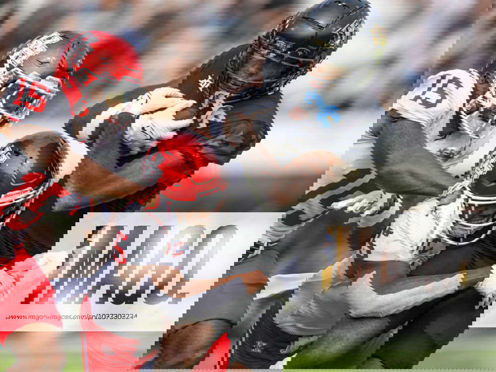 : UCF Knights wide receiver Kobe Hudson is tackled by Houston Cougars ...