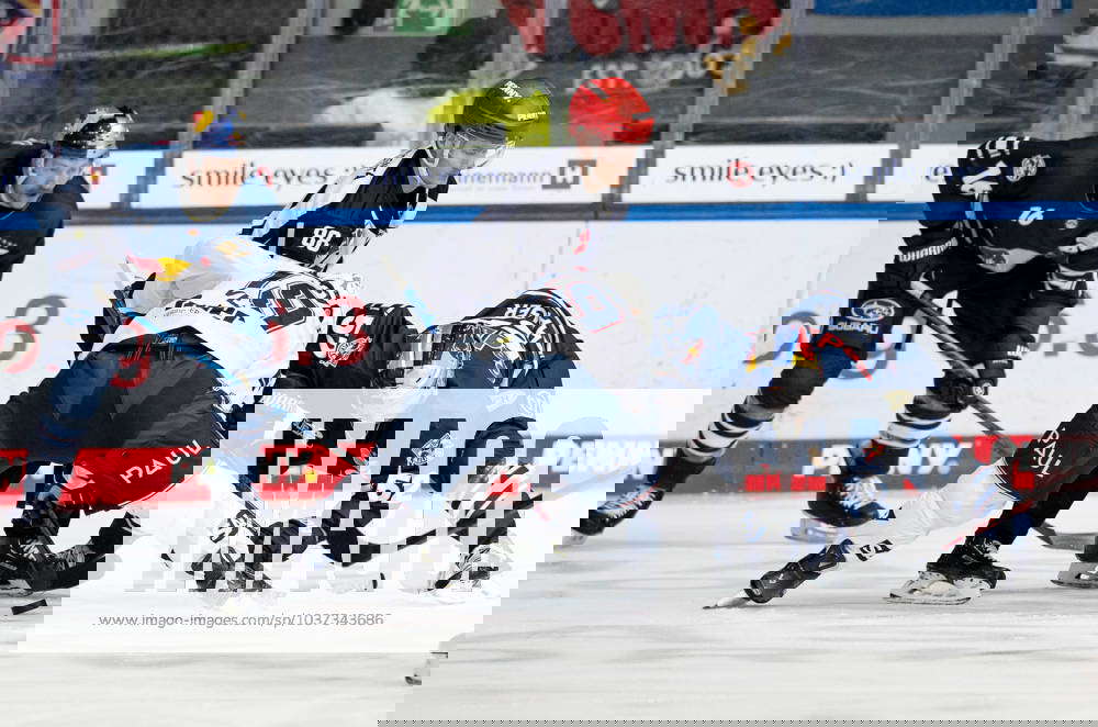 Linesman Tim Heffner takes a faceoff that Patrick Hager EHC Red Bull ...